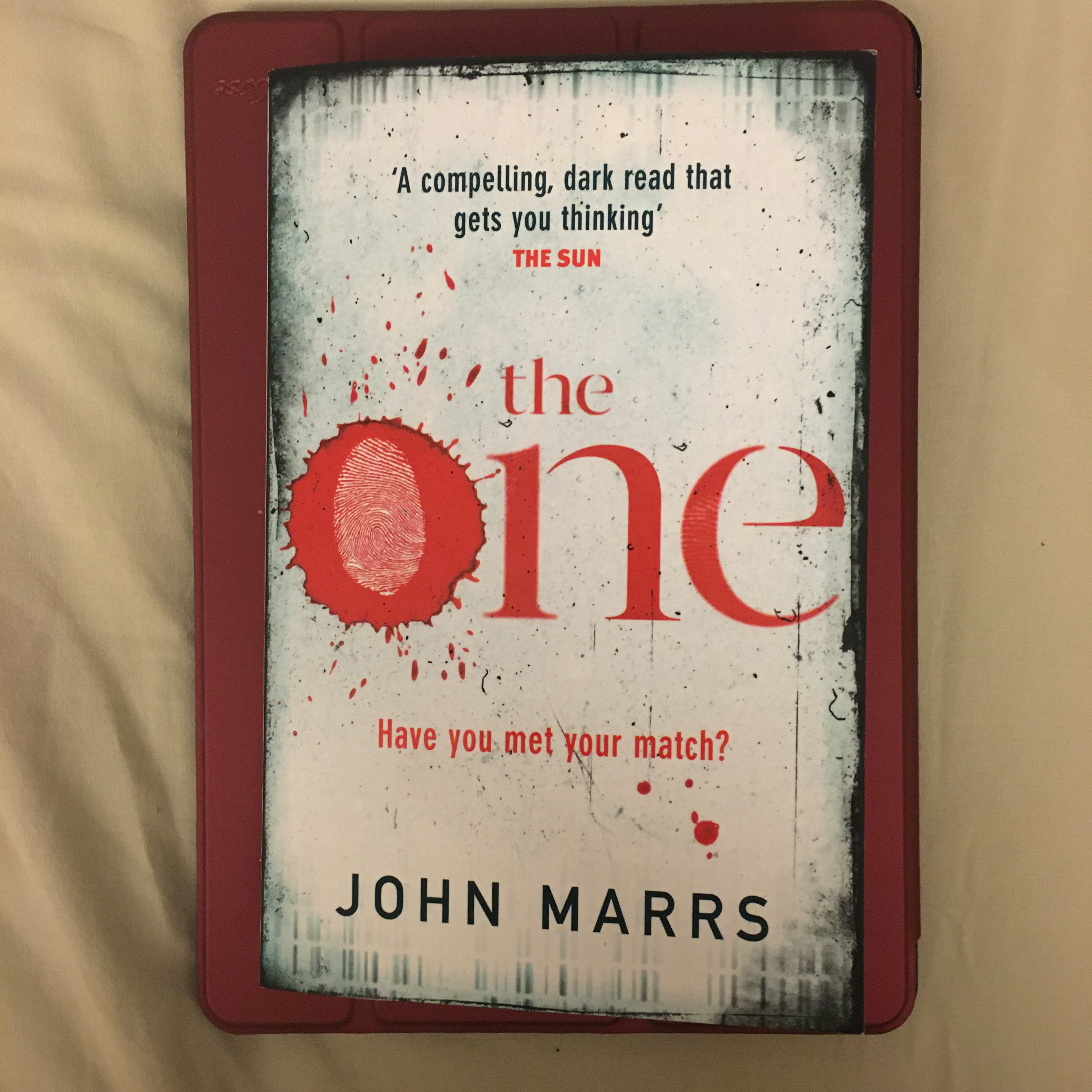 ♯1. The One by John Marrs – At the End of the World is a Book
